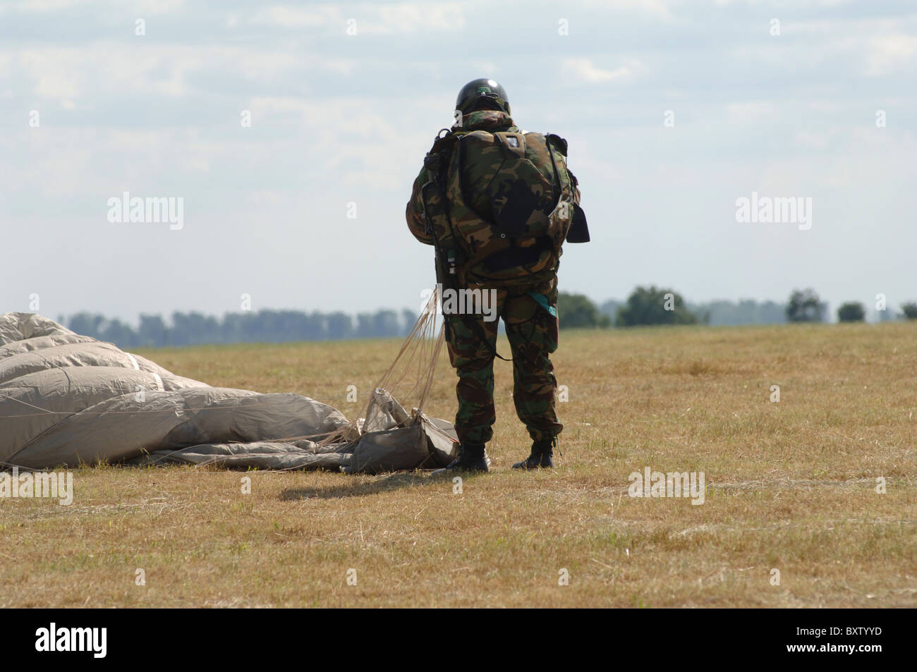 A member of the Pathfinder Platoon collapses his parachute after a HALO ...