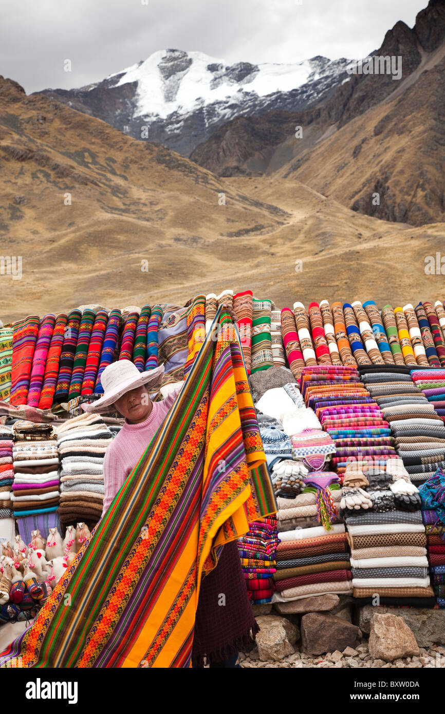 Street market stall selling cloth and typical Peruvian goods, La Raya ...
