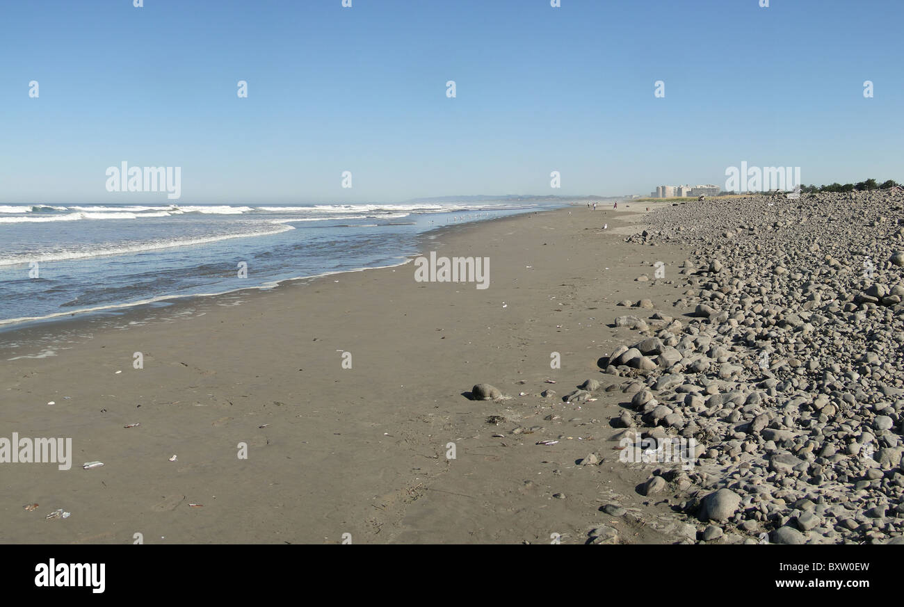 Detail, sea rounded pebbles at high tide line on the beach at Seaside ...