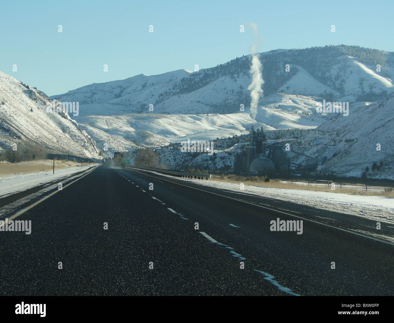 Tracker trailers drive cautiously on icy roads in Eastern Oregon Stock ...