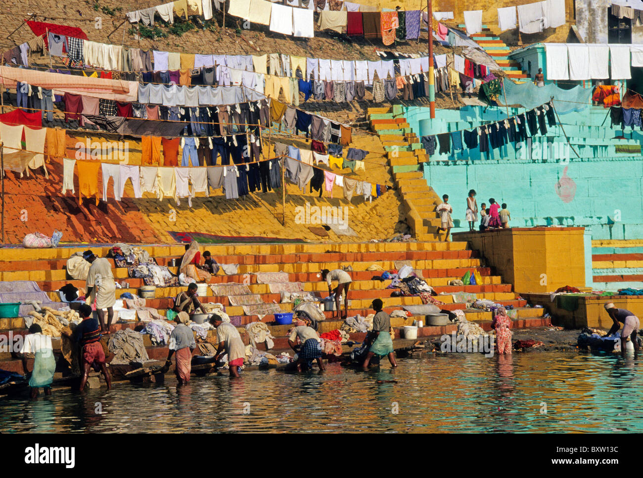Dhobi wallahs doing laundry in the Ganges, Varanasi, India Stock Photo ...