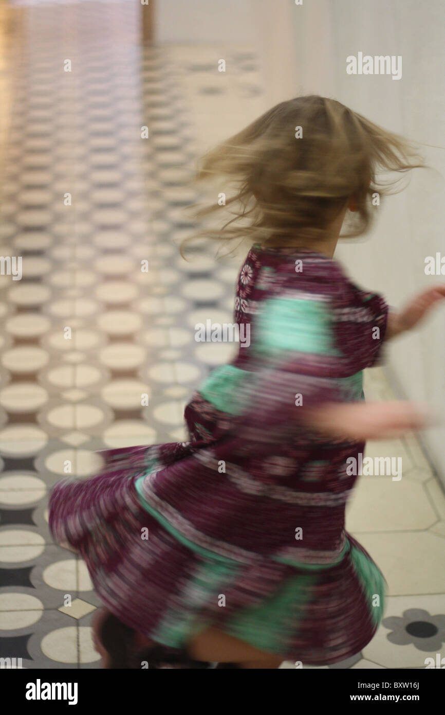 little girl turn and dance Stock Photo - Alamy