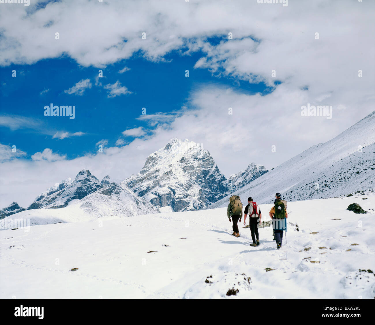 Hikers Climbing Across Mountain Stock Photo - Alamy