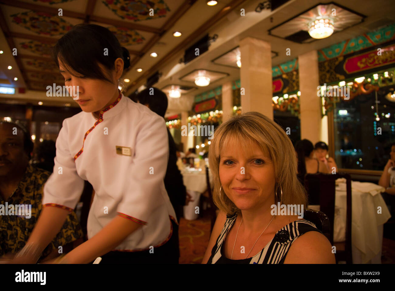 Chinese waitress seafood hi-res stock photography and images - Alamy