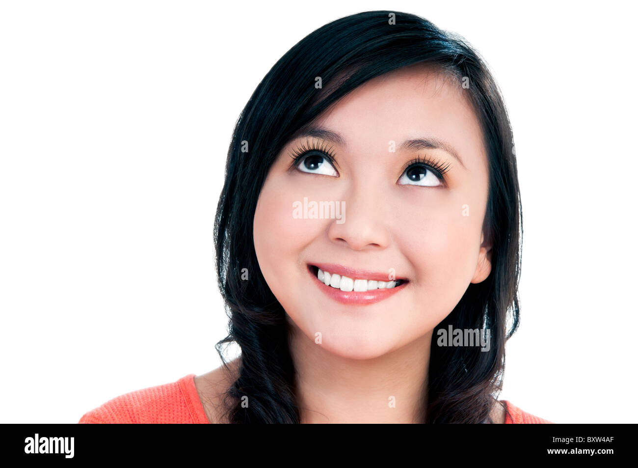 Beautiful young woman looking up Stock Photo - Alamy