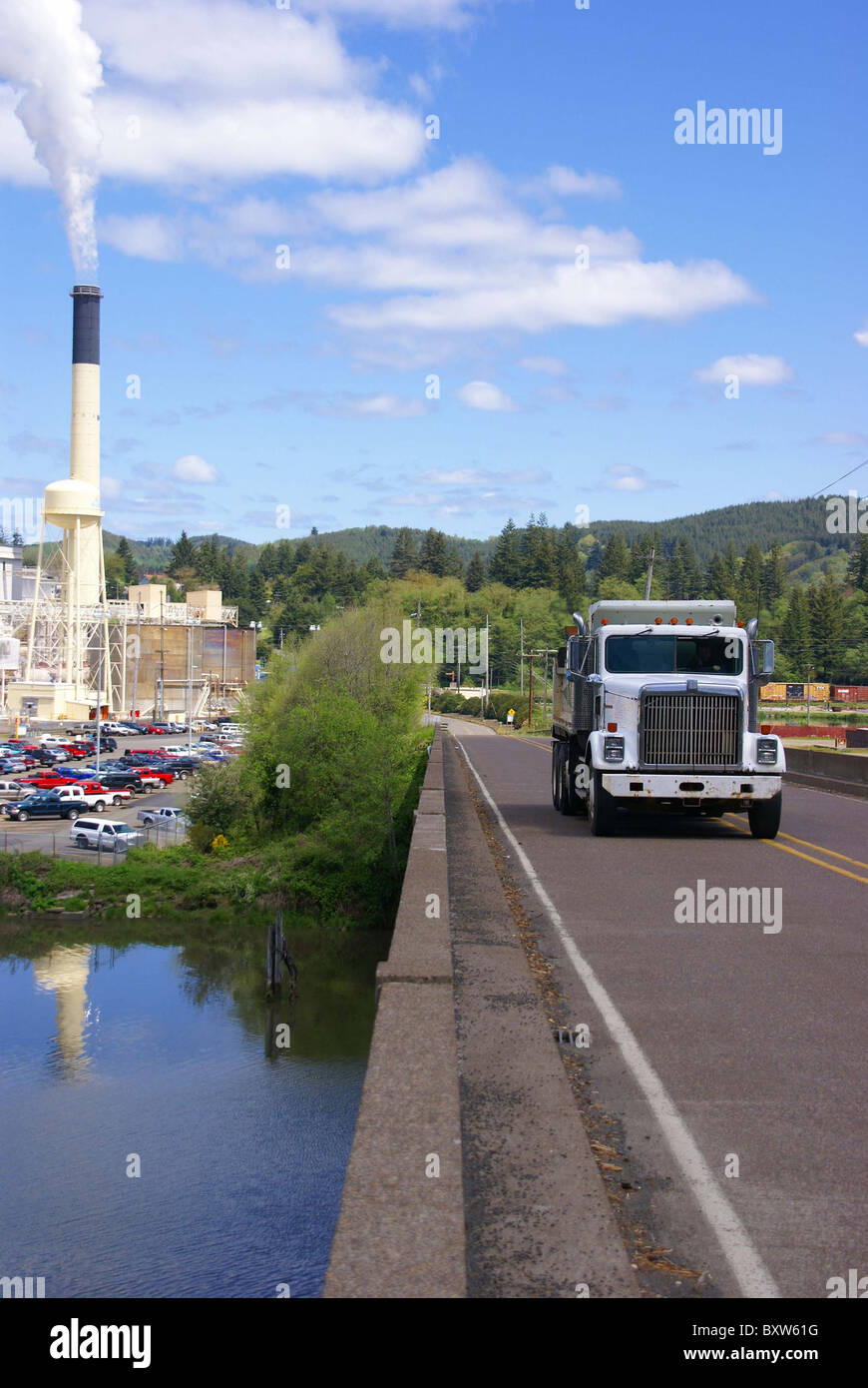 Truck crossing bridge near pulp and paper mill, Toledo, Oregon Coast ...