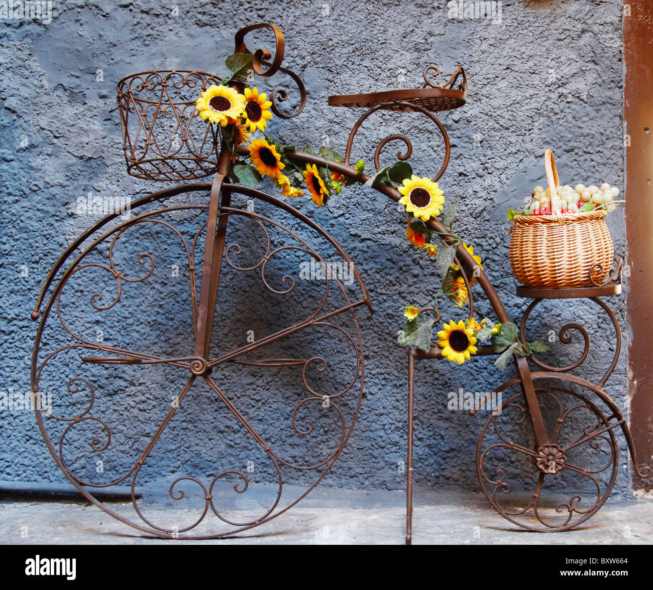 Rusty wrought iron bike in restaurant in Spain Stock Photo - Alamy