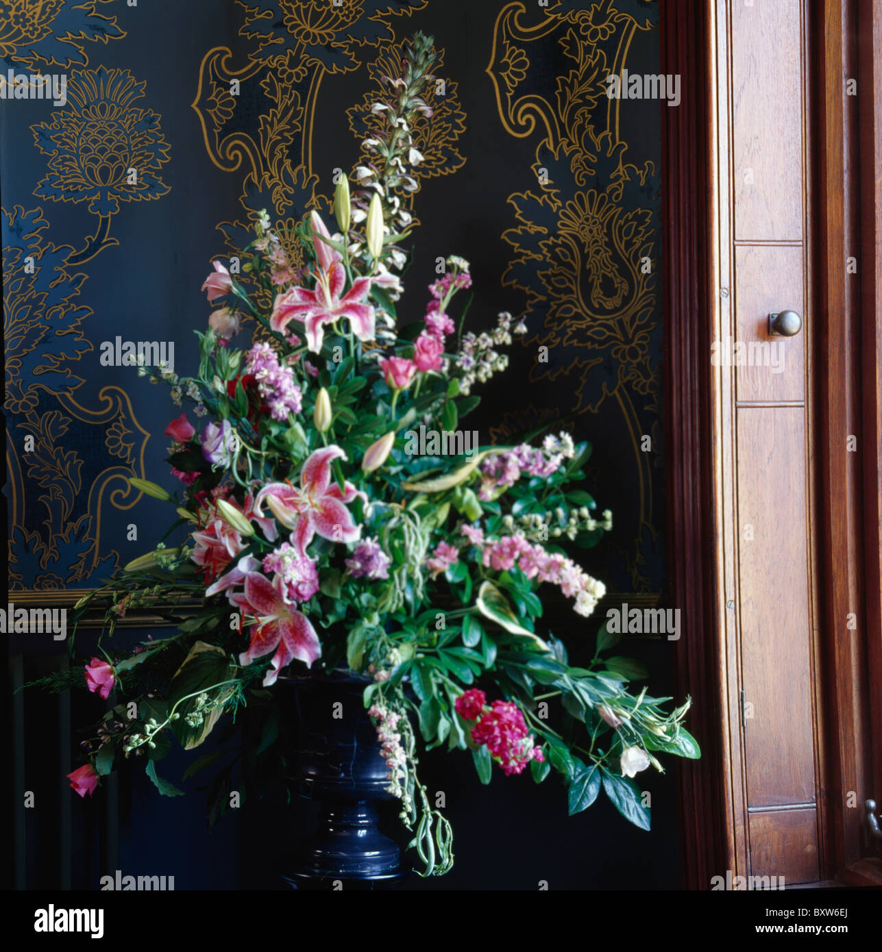 Close-up of pink lilies and stocks in formal floral arrangement Stock ...