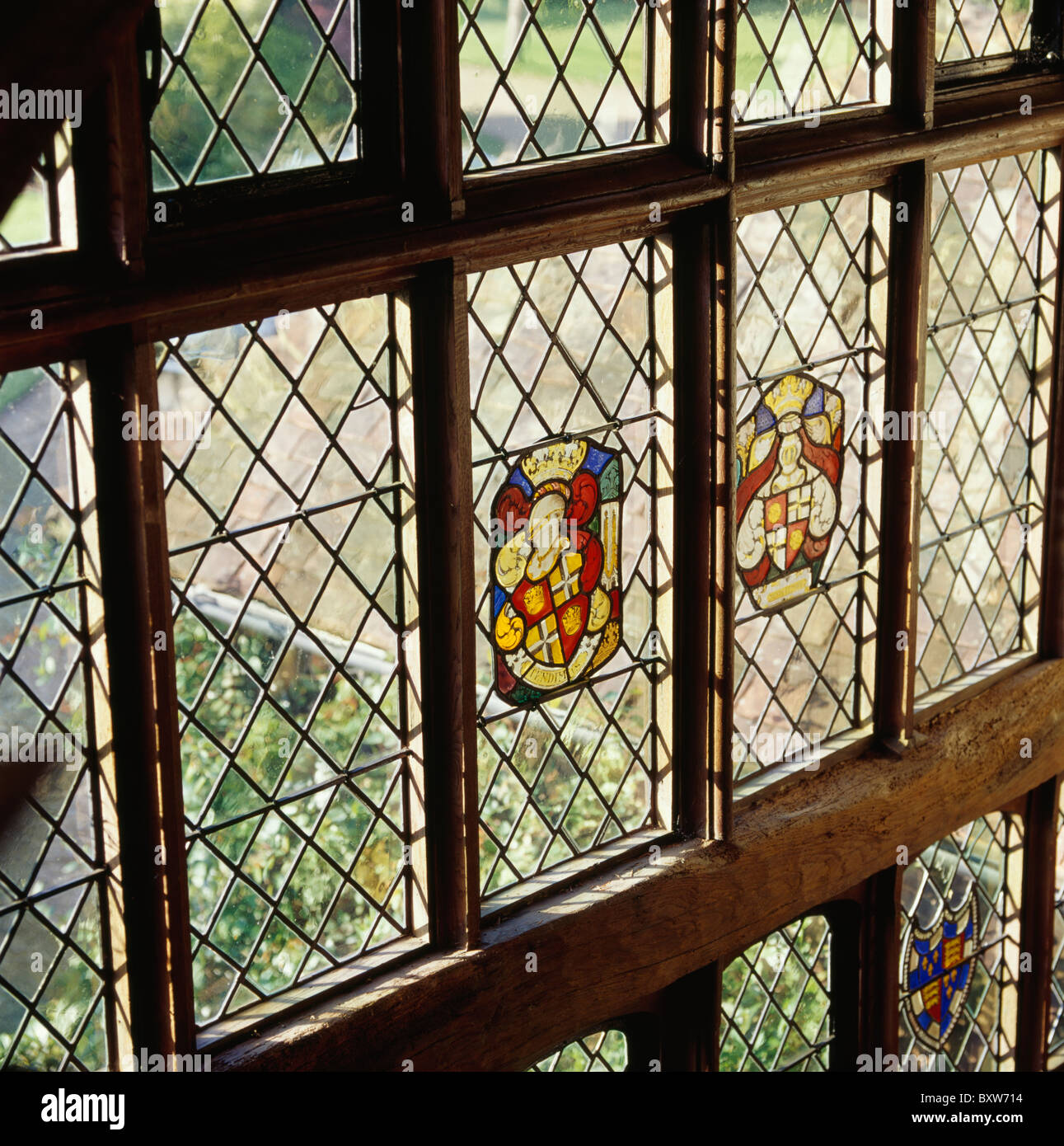 Close-up of old lattice-paned window with stained-glass panels Stock ...