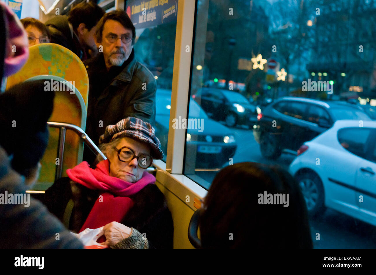 Passengers on a bus looking at the traffic outside the window Stock ...