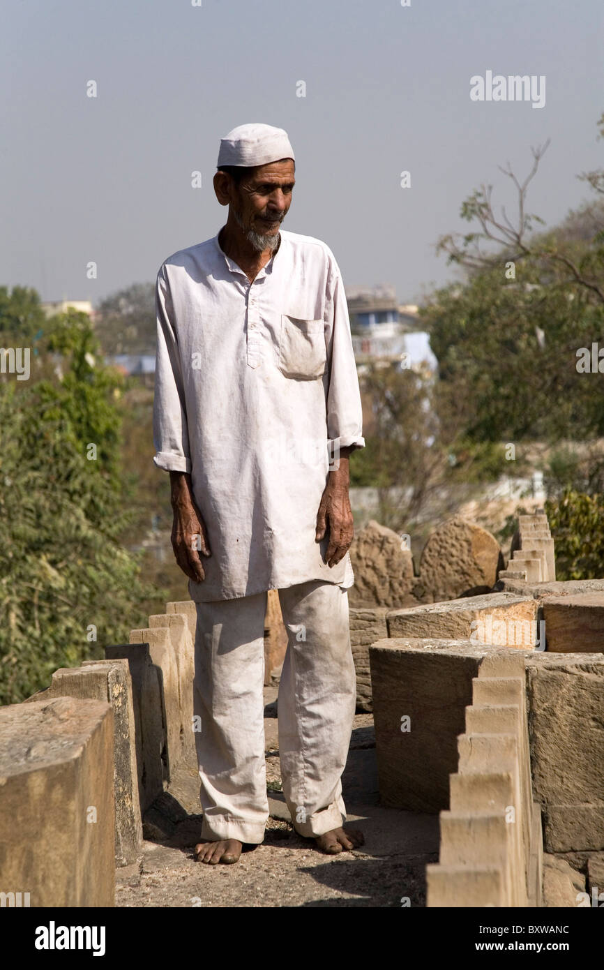 A Muslim man stands on the roof of the Bai Harir Mosque at Ahmedabad ...