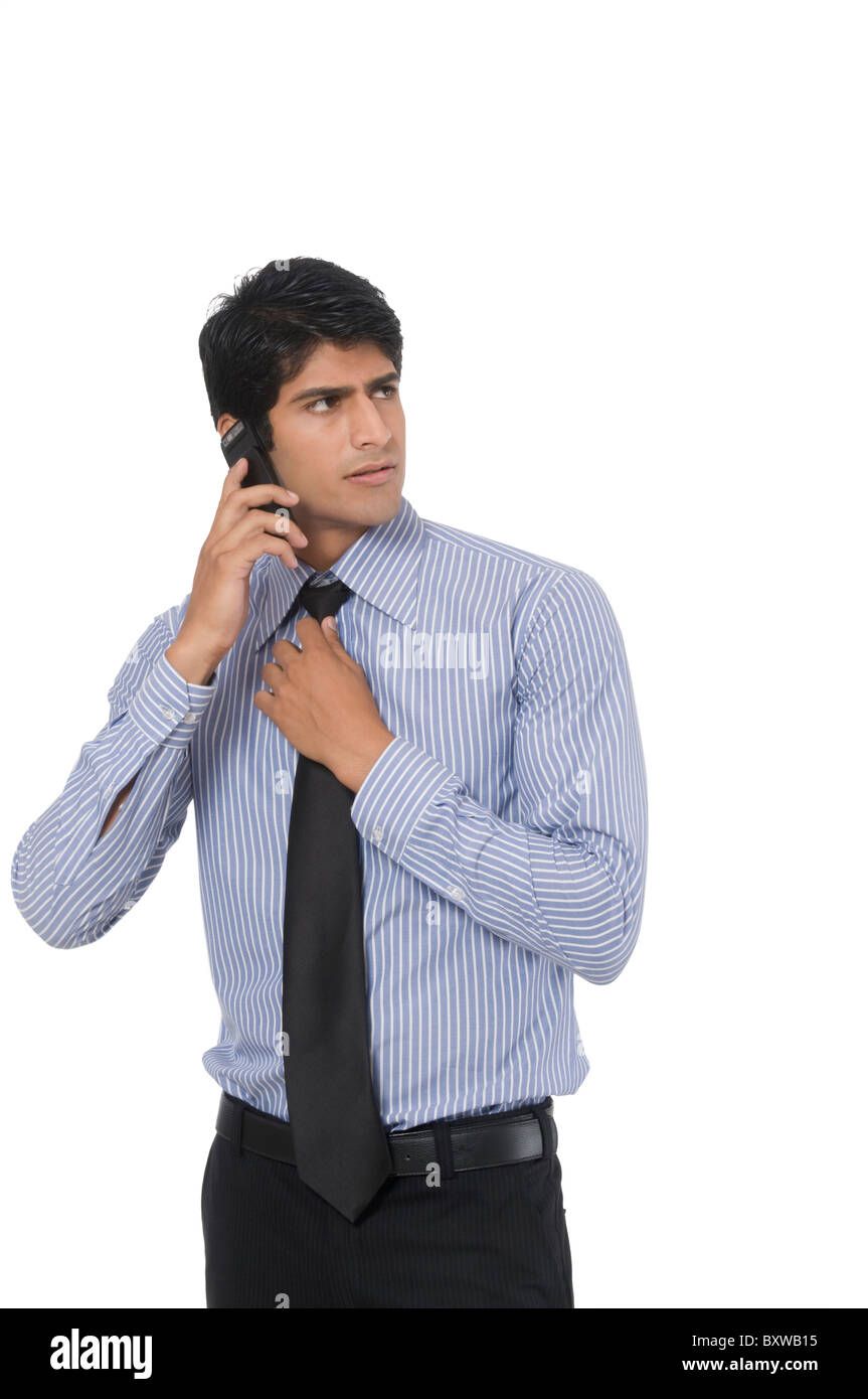 A young man standing facing the camera Stock Photo - Alamy