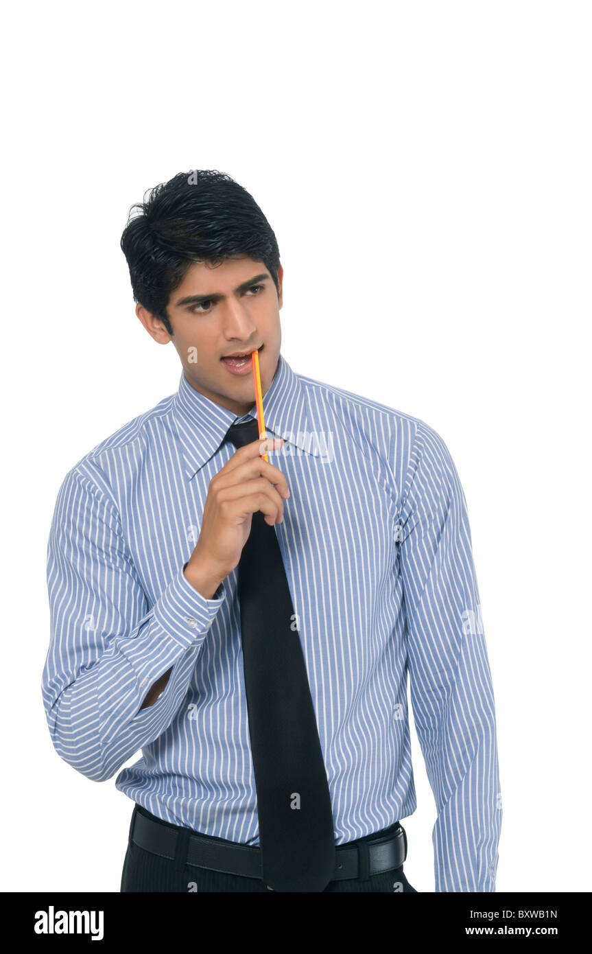 A young man standing facing the camera Stock Photo - Alamy