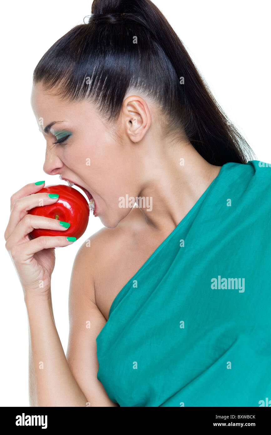 Young woman biting an apple Stock Photo - Alamy