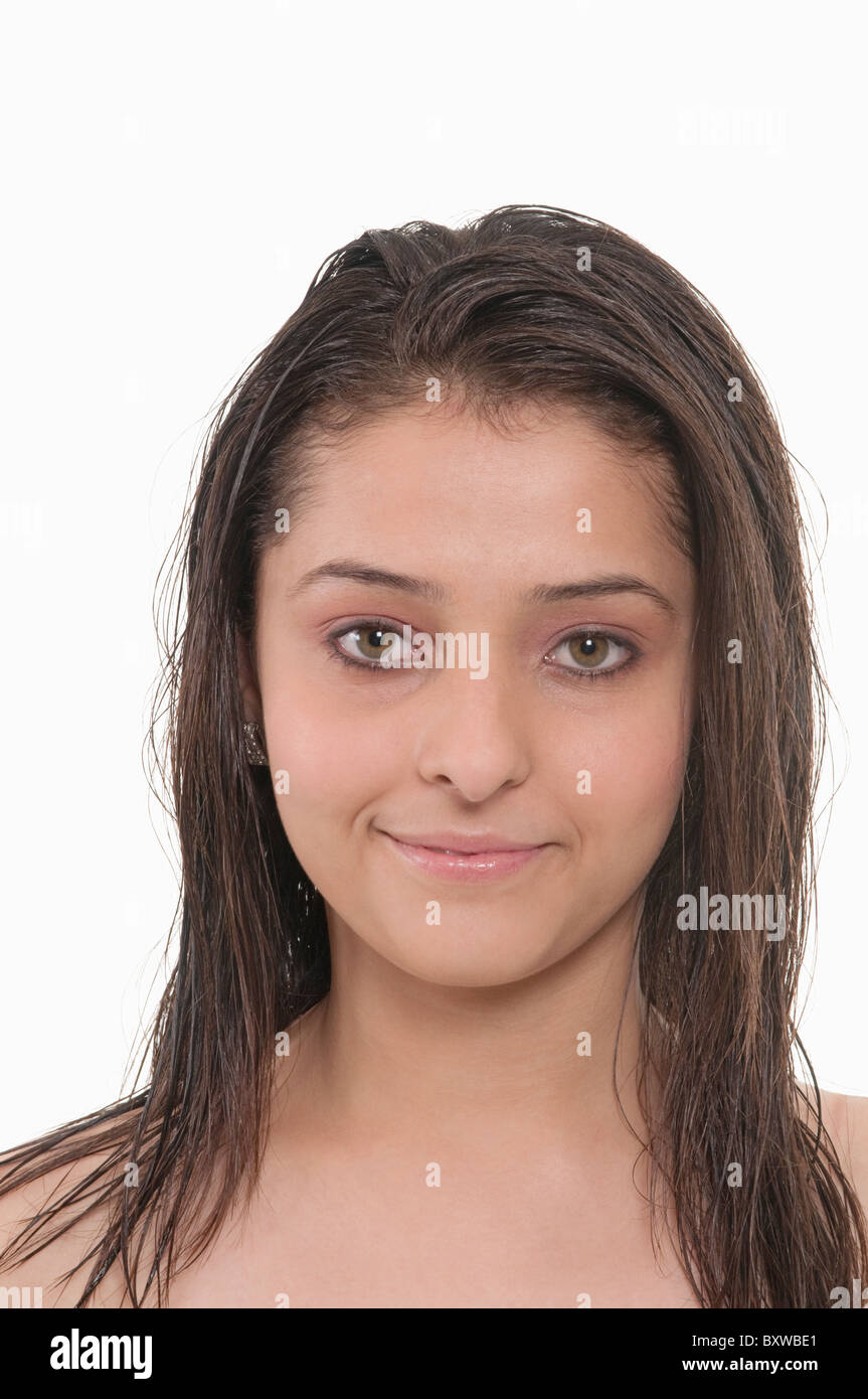 A woman smiling facing teh camera Stock Photo - Alamy