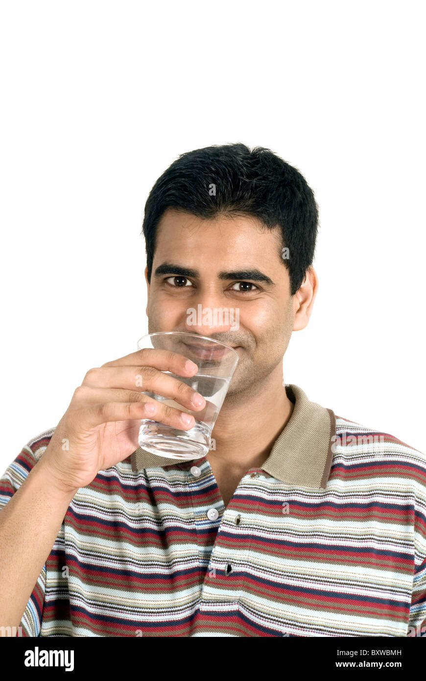 A man dringking water facing teh camera Stock Photo - Alamy