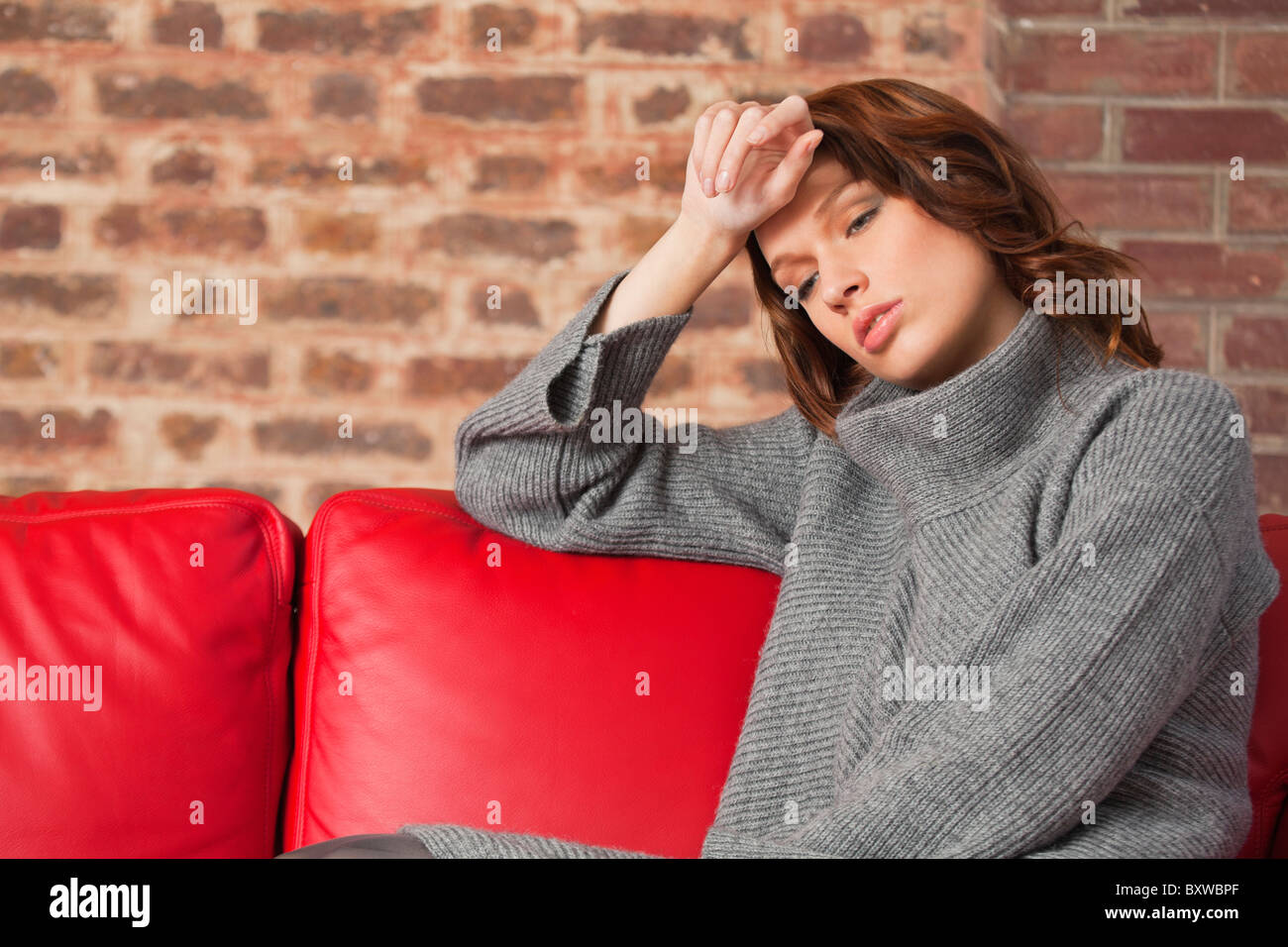 Young woman looking tired Stock Photo - Alamy
