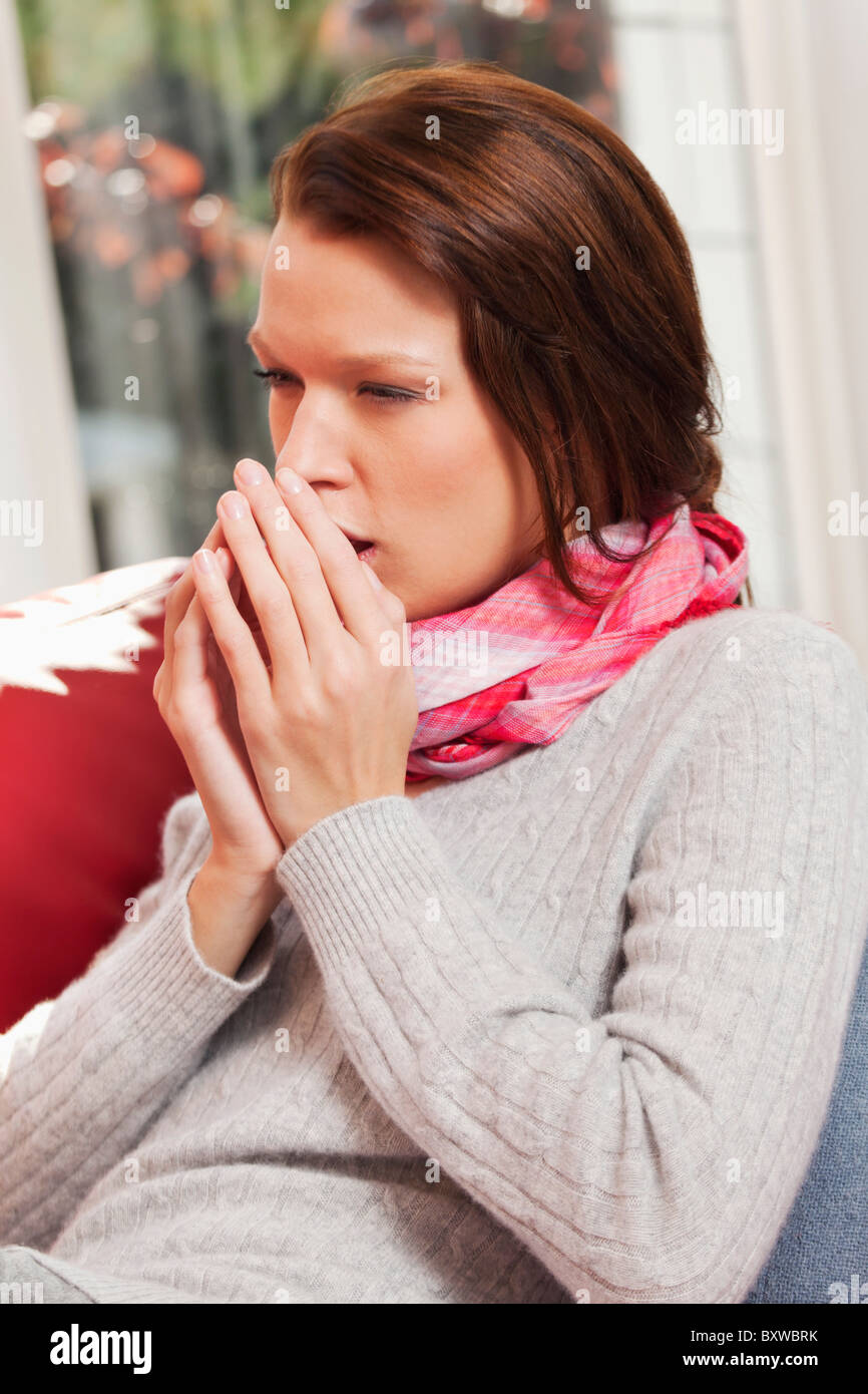 Young woman coughing Stock Photo - Alamy