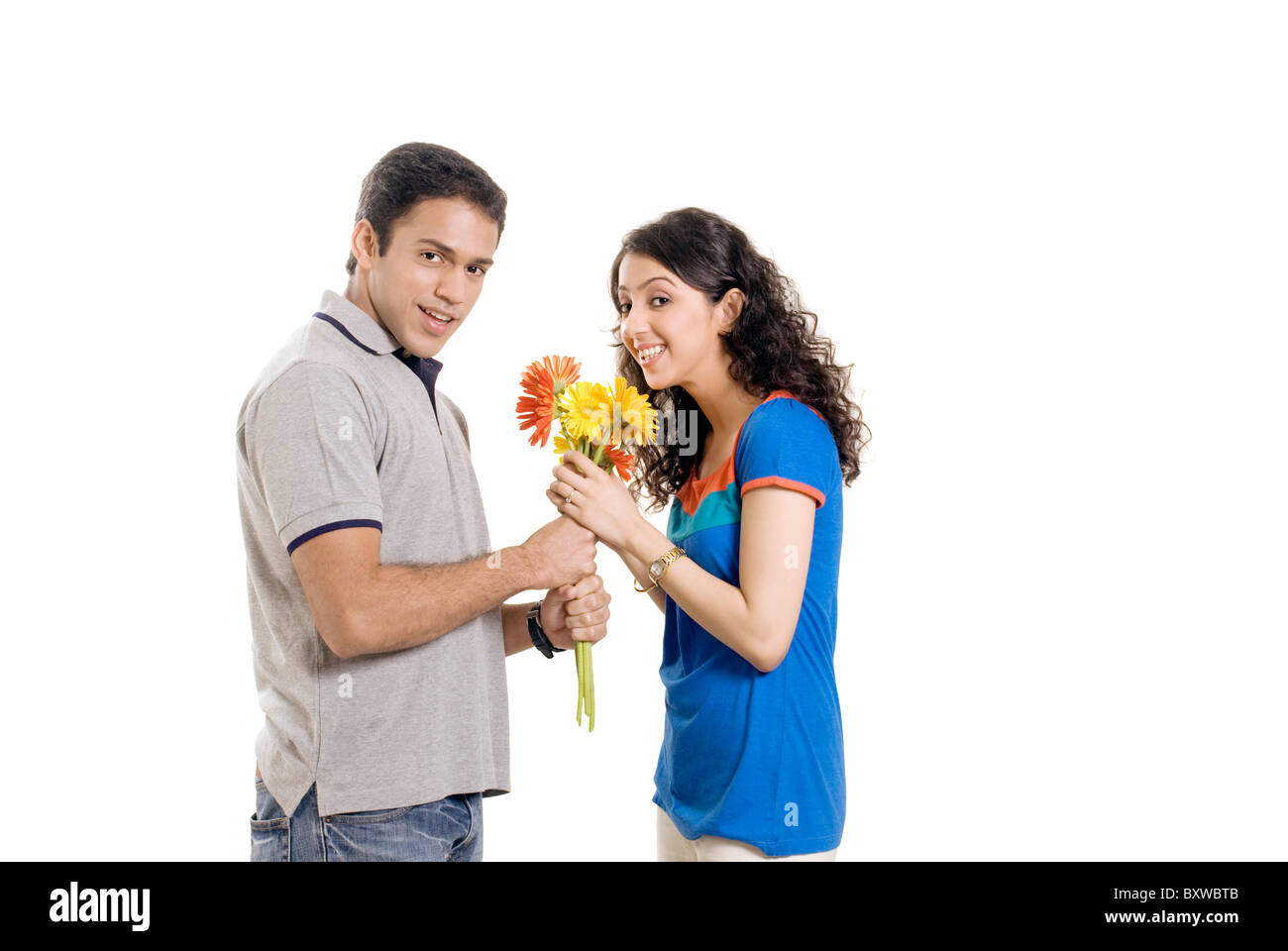 Man orange shirt holding Cut Out Stock Images & Pictures - Alamy