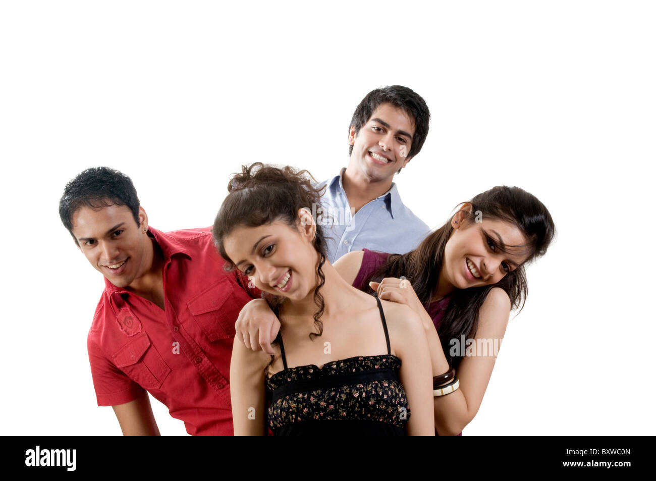 A group of four people facing the camera Stock Photo - Alamy