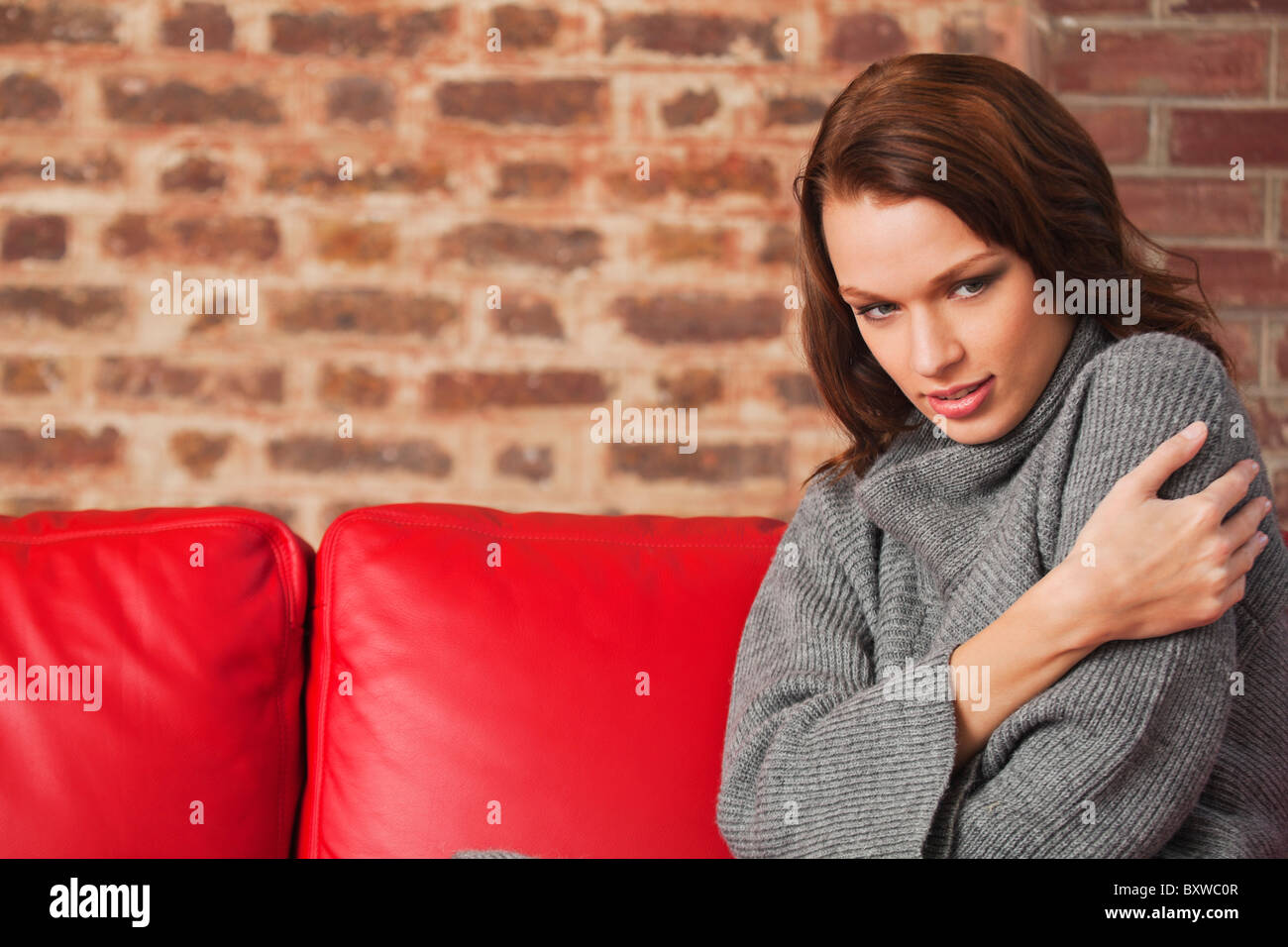Young woman looking down Stock Photo - Alamy