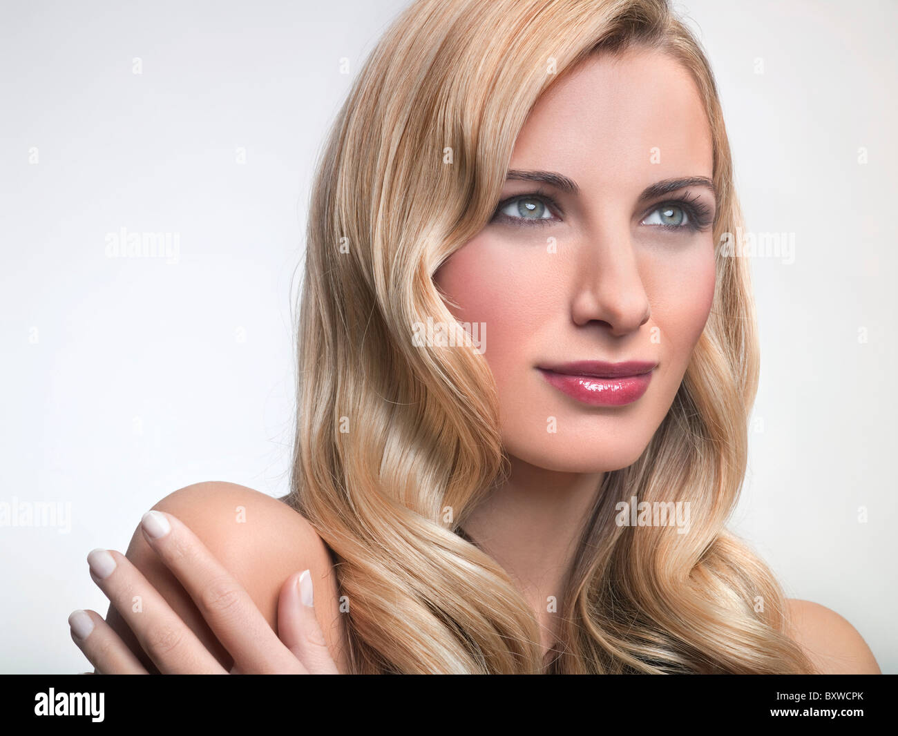 Young woman looking away Stock Photo - Alamy