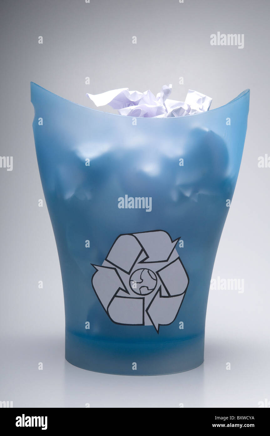 Paper in a recycling bin Stock Photo - Alamy