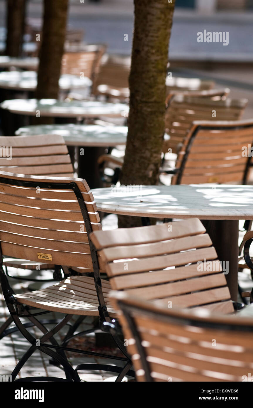 Empty tables and chairs of outdoor in dappled sunlight, UK Stock Photo ...