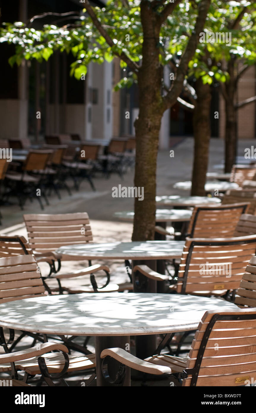 Empty tables and chairs of outdoor in dappled sunlight, UK Stock Photo ...