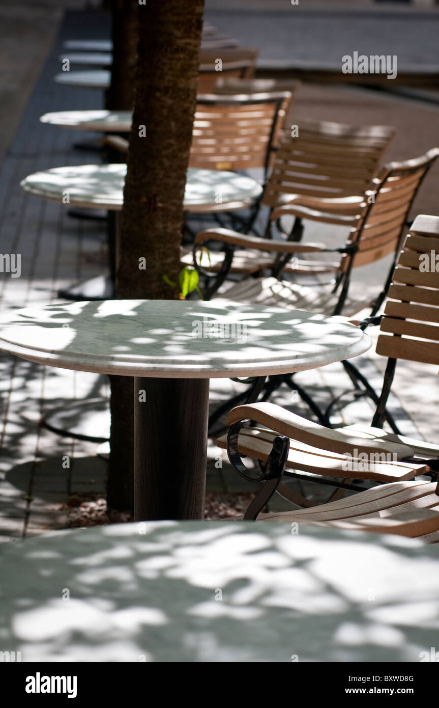 Empty tables and chairs of outdoor in dappled sunlight, UK Stock Photo ...