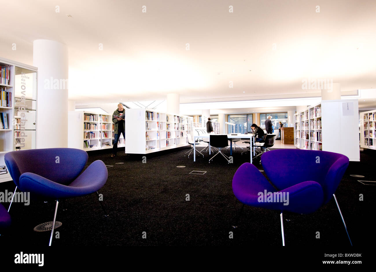 Interior public library in Amsterdam Netherlands with readers or ...