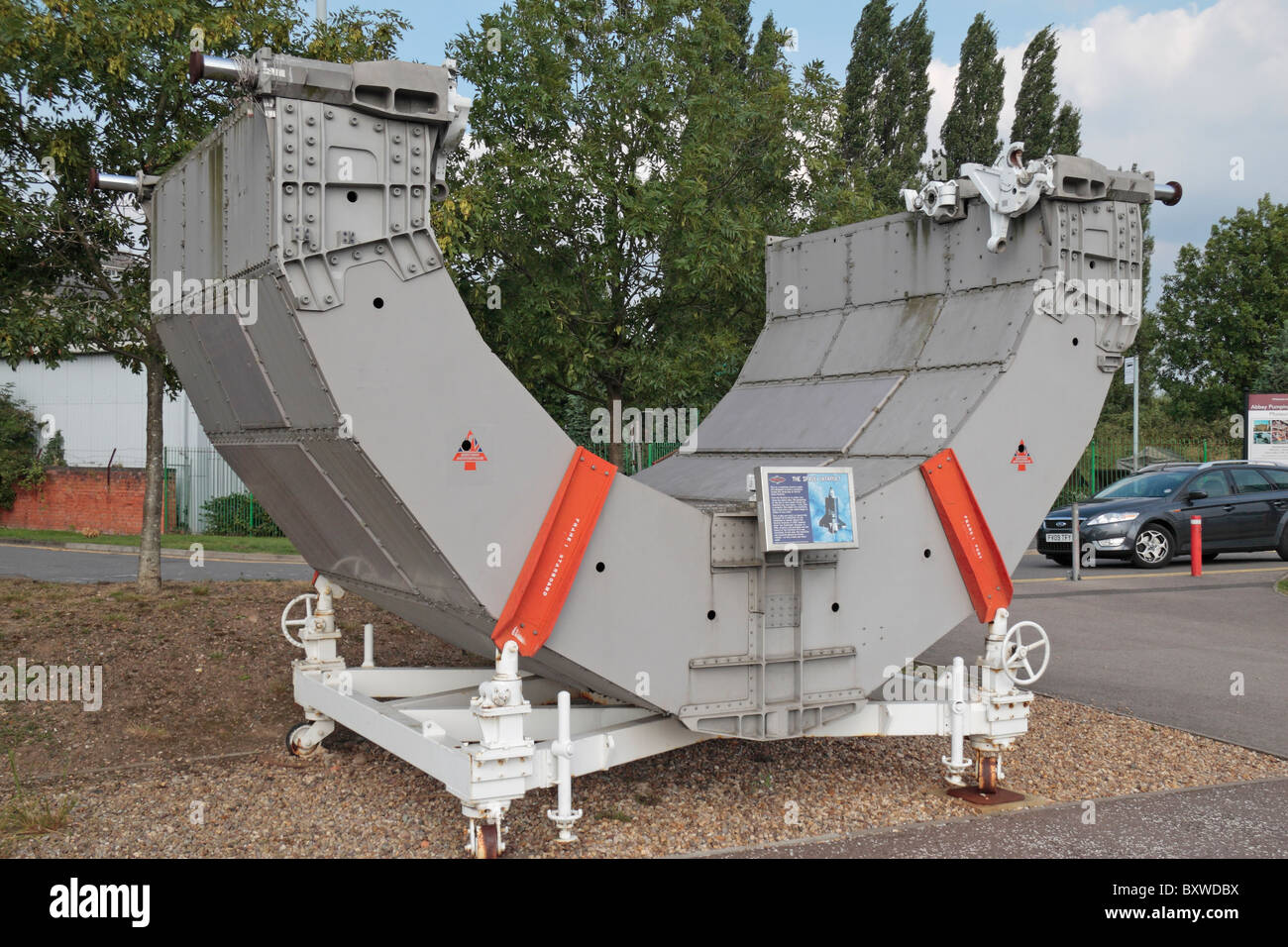 A satellite launch cradle from the Space Shuttle on display outside the ...