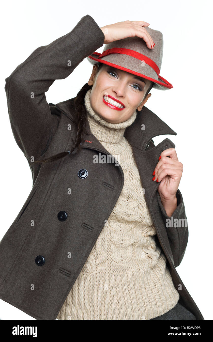 Young woman wearing jacket and fedora Stock Photo - Alamy
