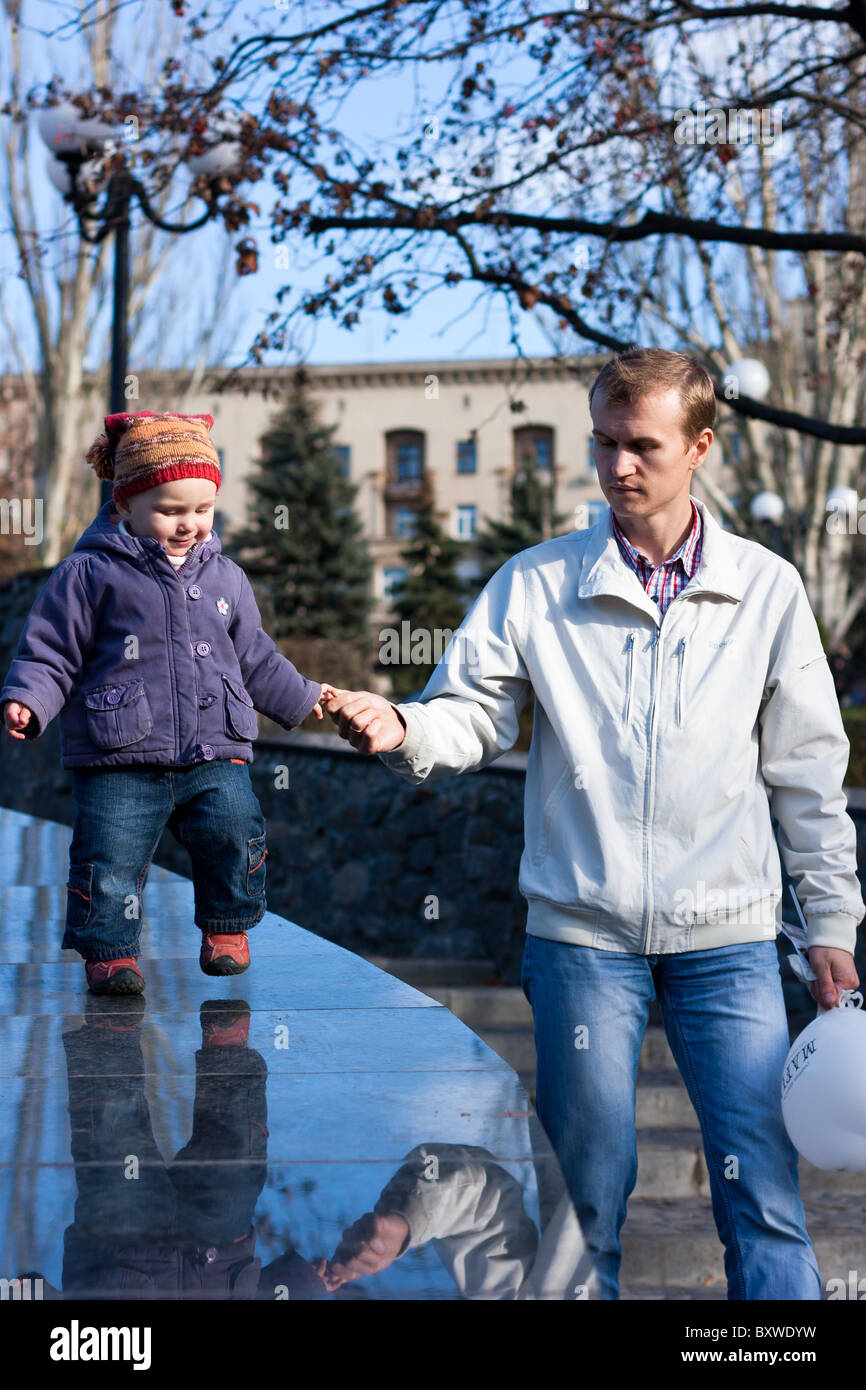 Beautiful baby with father walking outdoor Stock Photo - Alamy