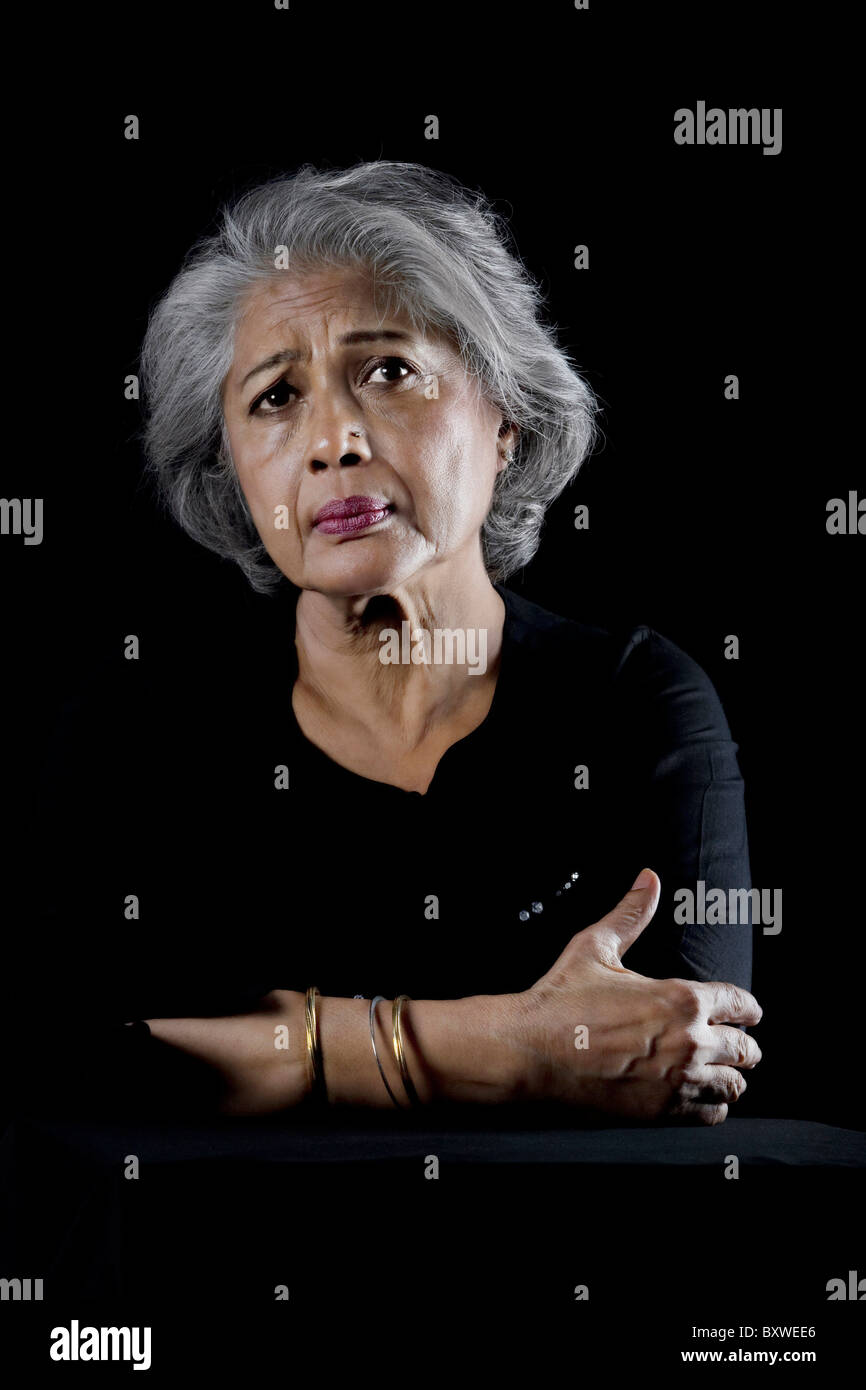 Old woman worried Stock Photo - Alamy