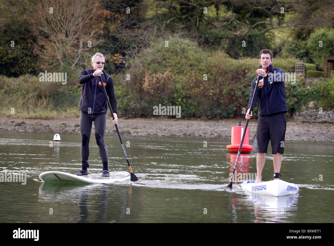 Stand up paddle boarding on a river in Devon UK Stock Photo - Alamy