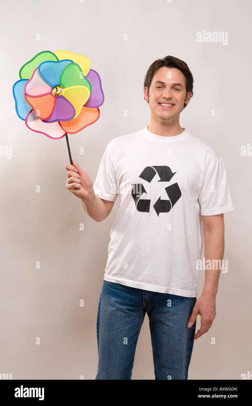 Man holding a colorful pinwheel Stock Photo - Alamy