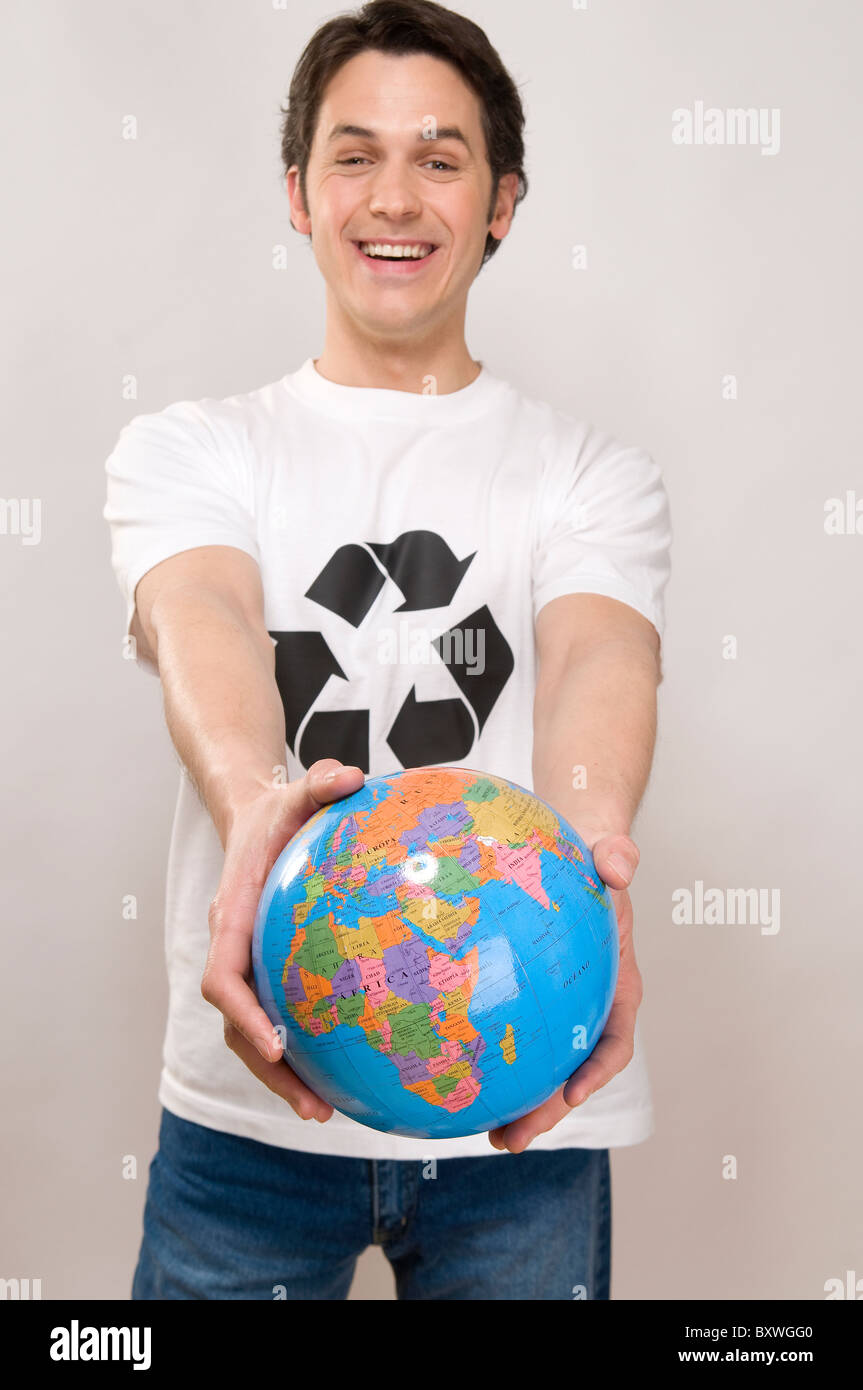 Man holding a globe Stock Photo - Alamy