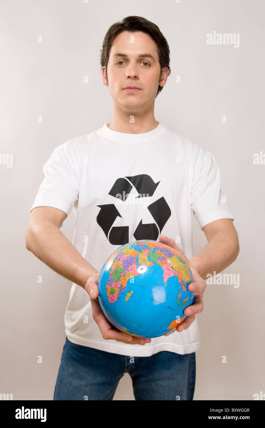 Man holding a globe Stock Photo - Alamy