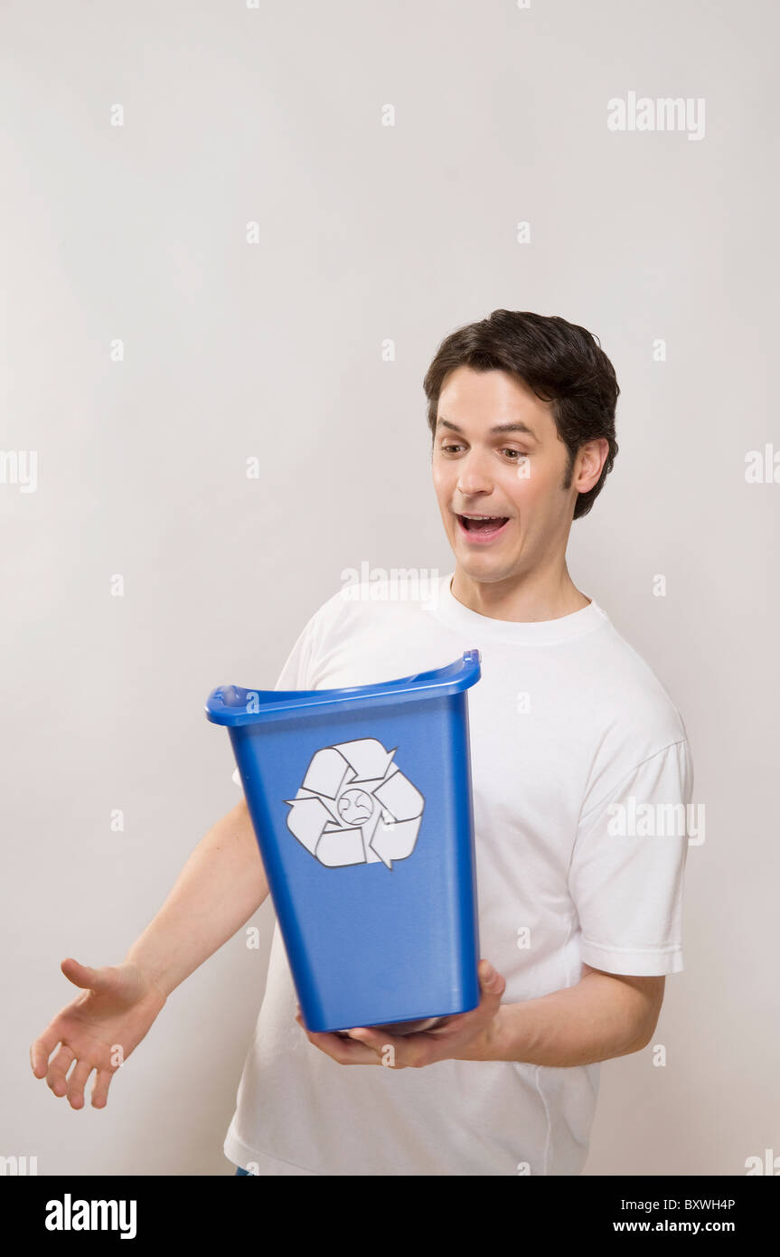 Man holding a recycling bin Stock Photo - Alamy