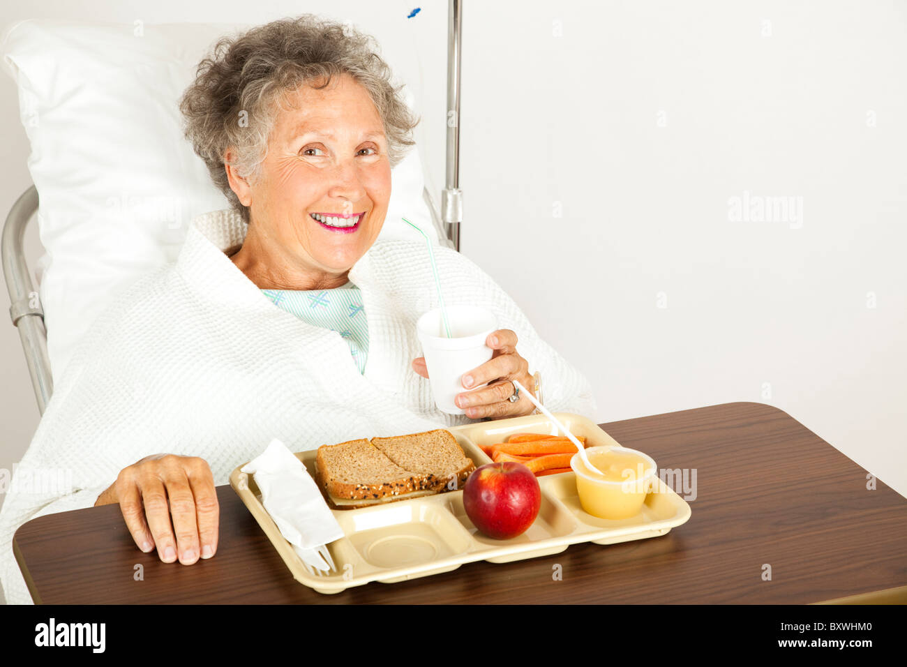 Senior hospital patient eating her lunch on a tray Stock Photo - Alamy