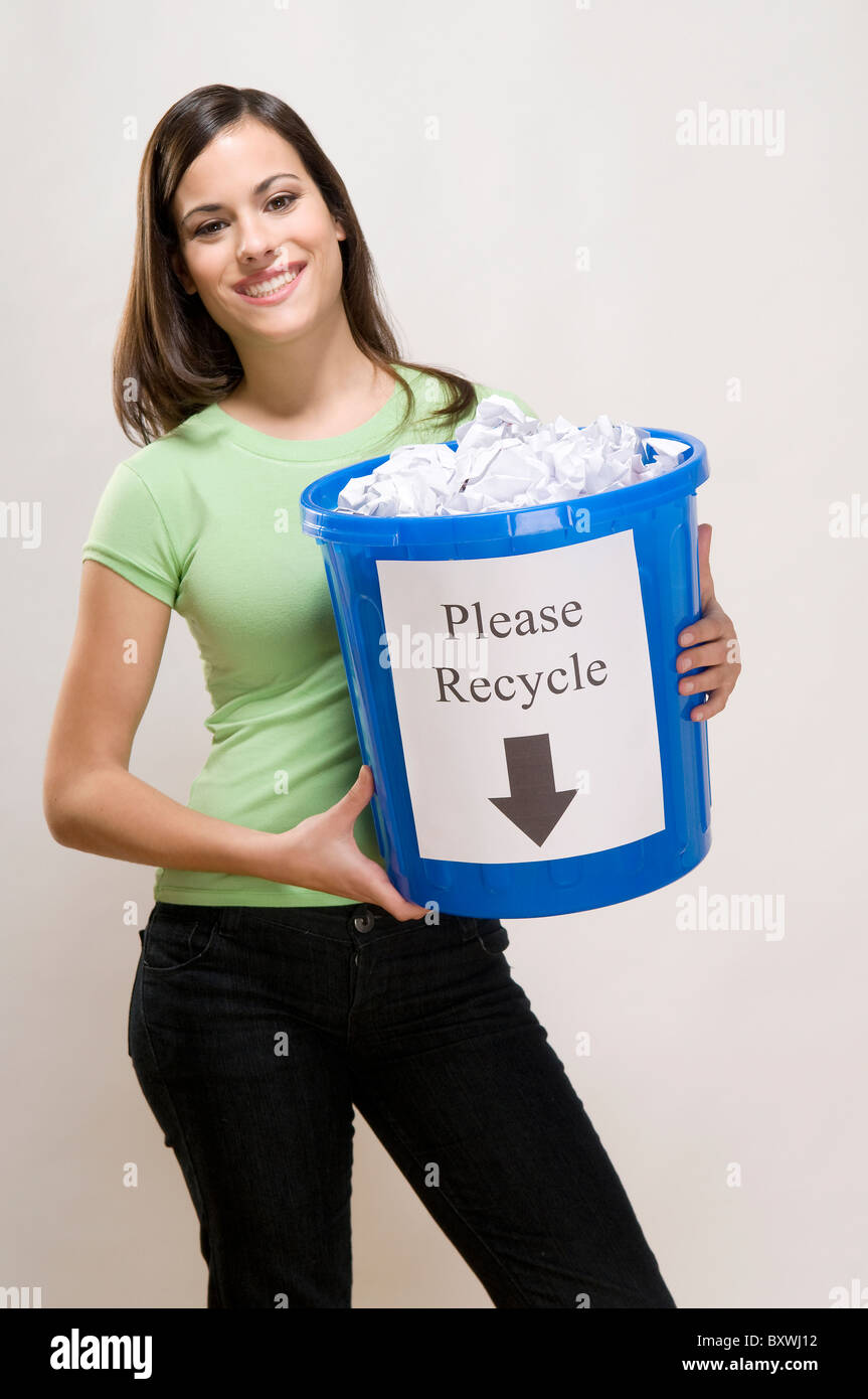 Woman holding recycling bin Stock Photo - Alamy