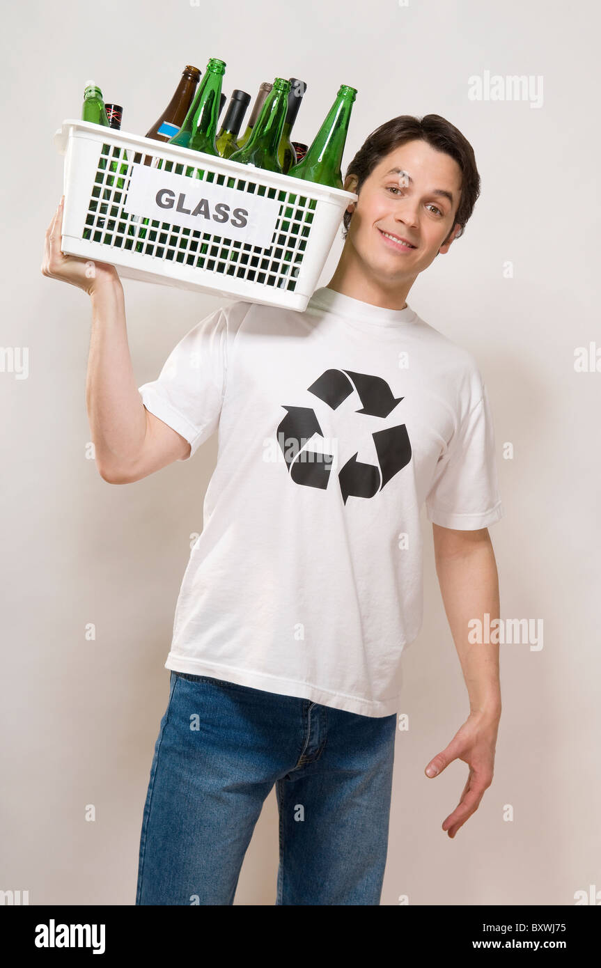 Man recycling empty bottles Stock Photo - Alamy