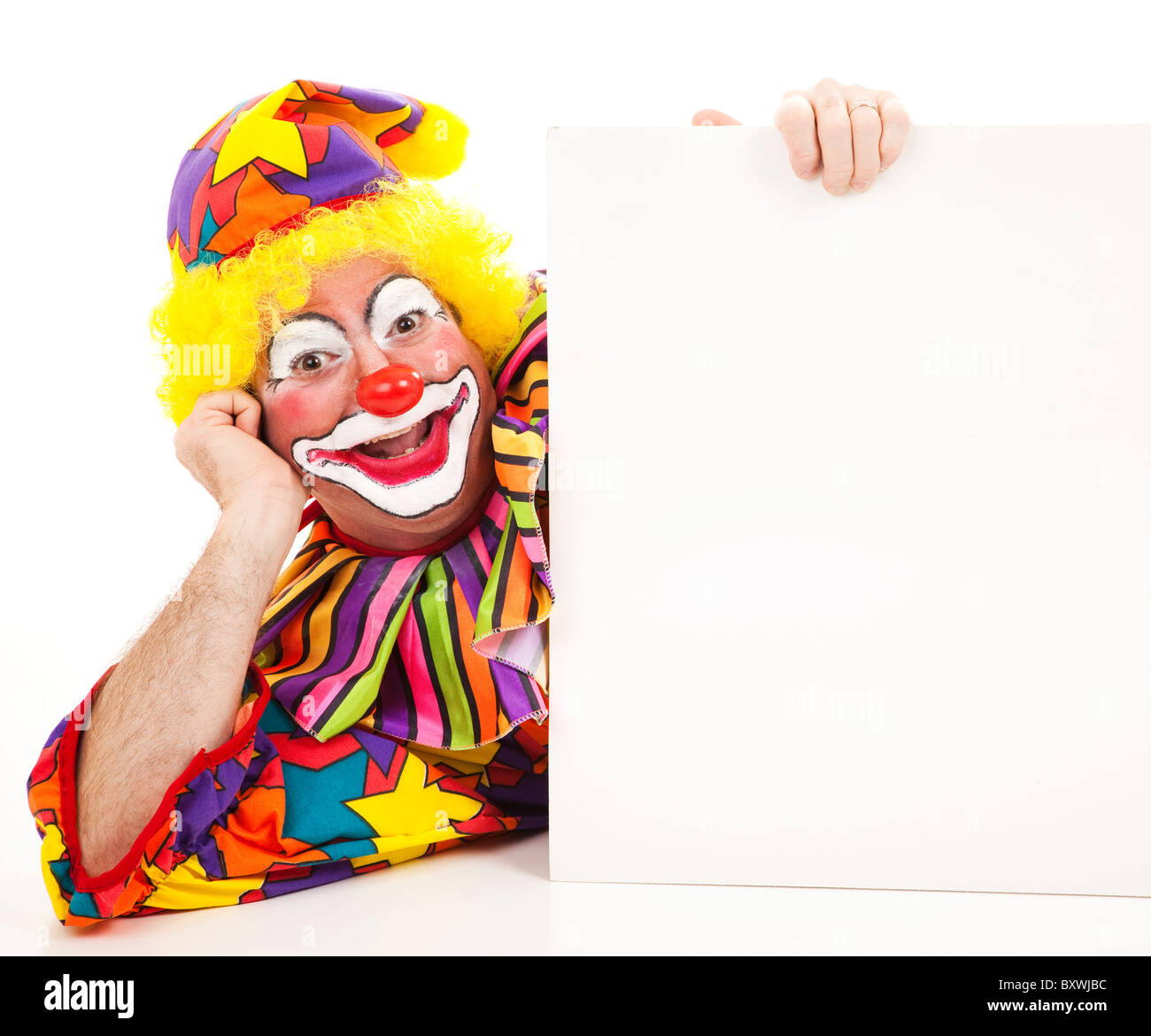 Clown lying on his side holding a blank white sign Stock Photo - Alamy