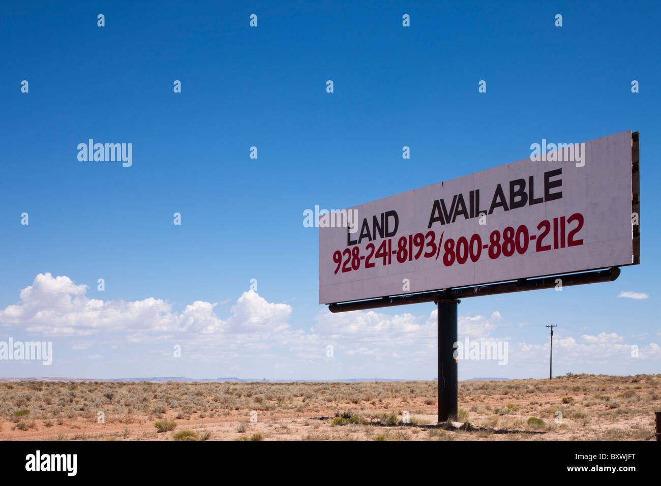 USA, Arizona, Holbrook, Land Available billboard sign in desert along ...