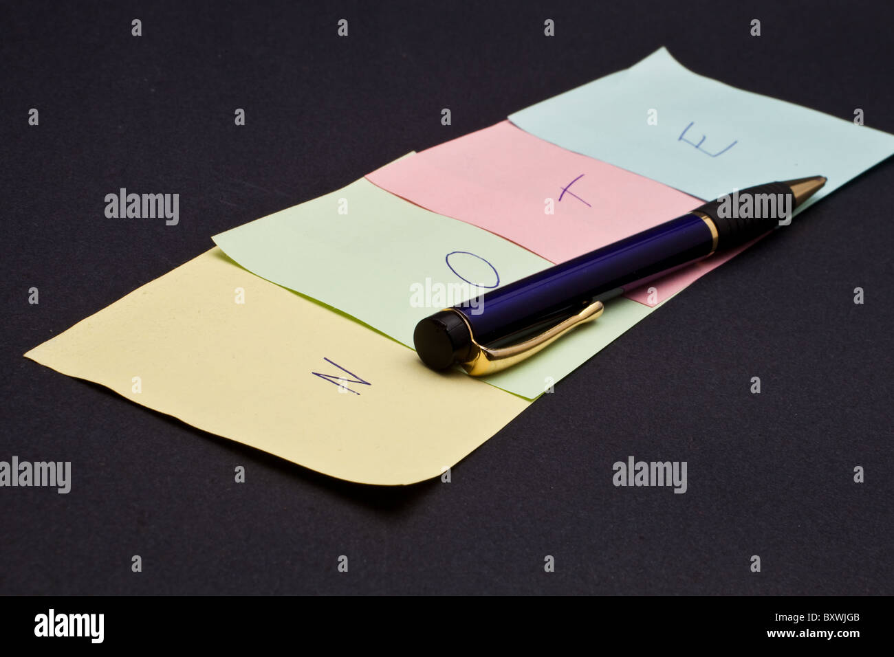 Sticky notes with a pen Stock Photo - Alamy