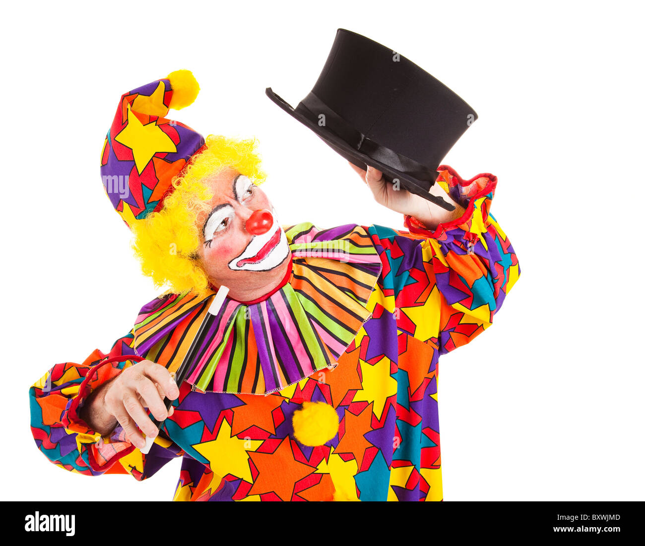 Clown magician looks inside this top hat wondering why the rabbit didn ...