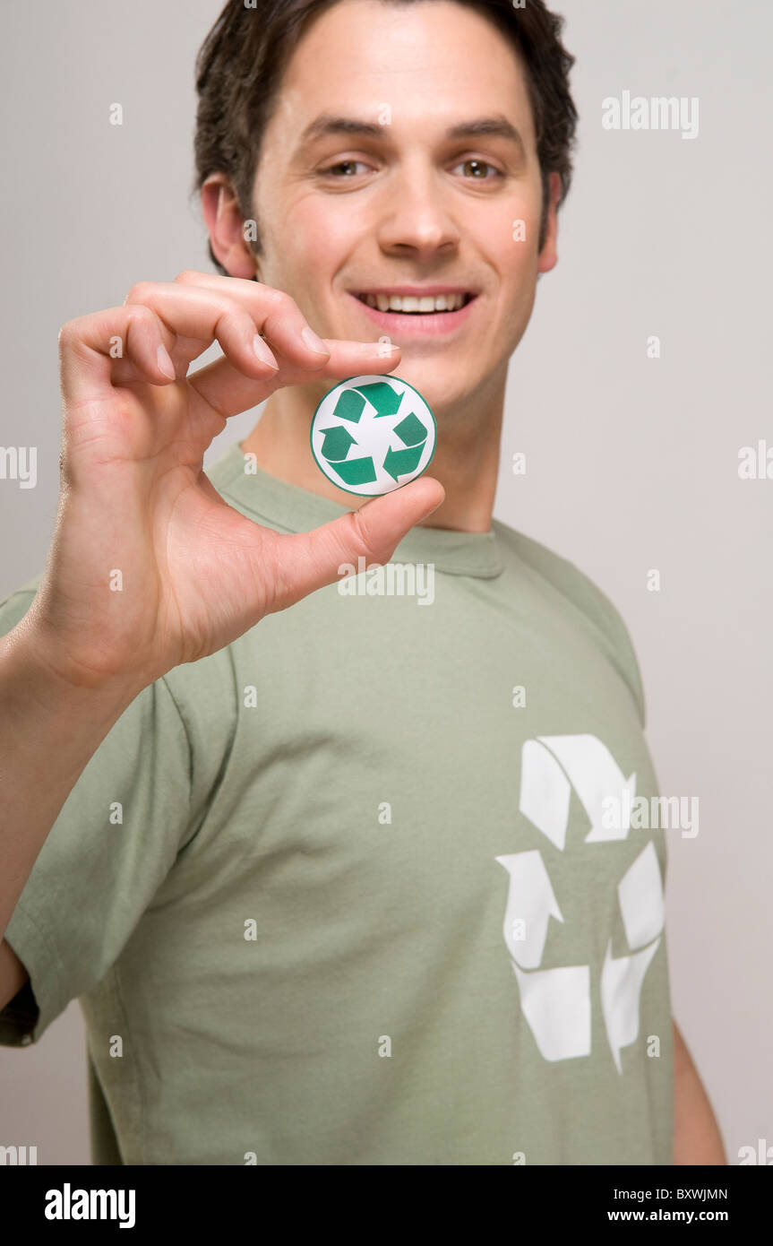 Man holding a recycling symbol Stock Photo - Alamy