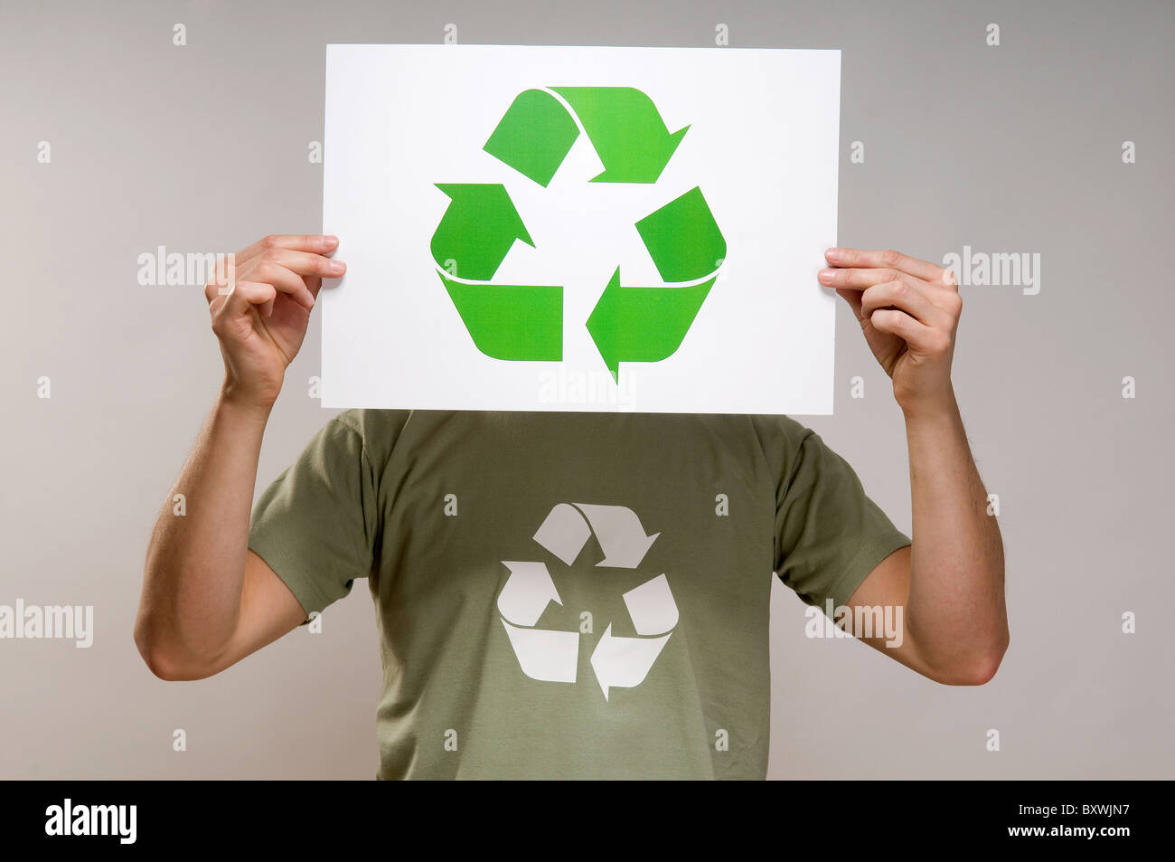 Man holding a recycling symbol Stock Photo - Alamy