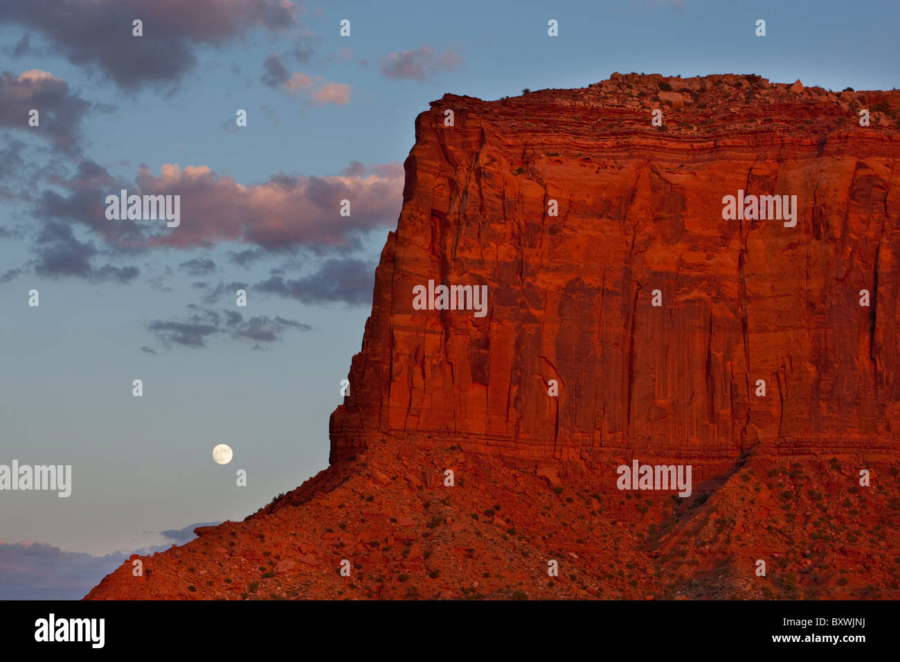USA, Arizona, Monument Valley Navajo Tribal Park, Moon rises behind red ...